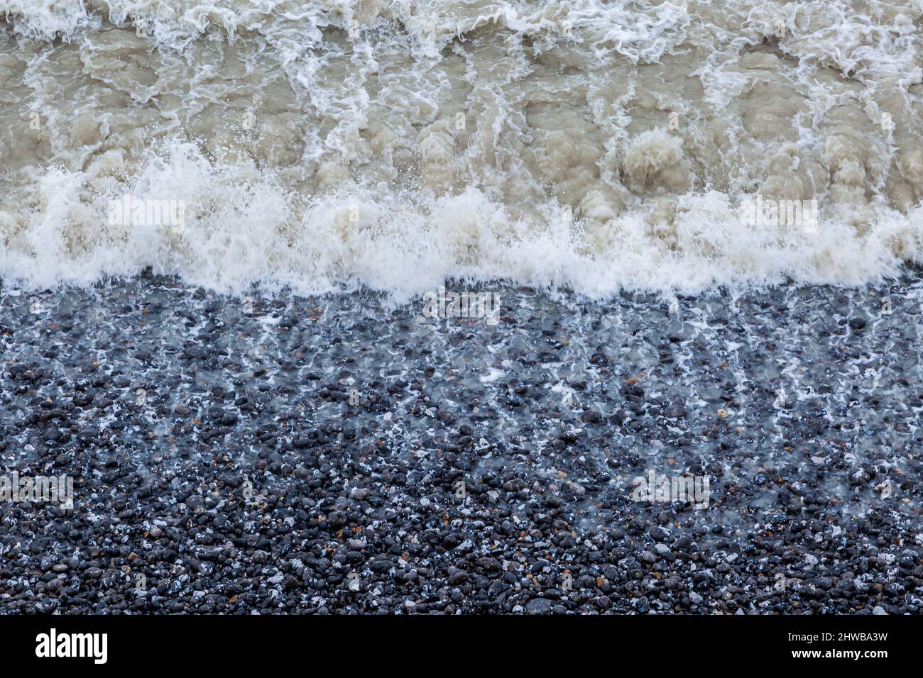The Waters Edge on a Pebble Beach Stock Photo - Alamy