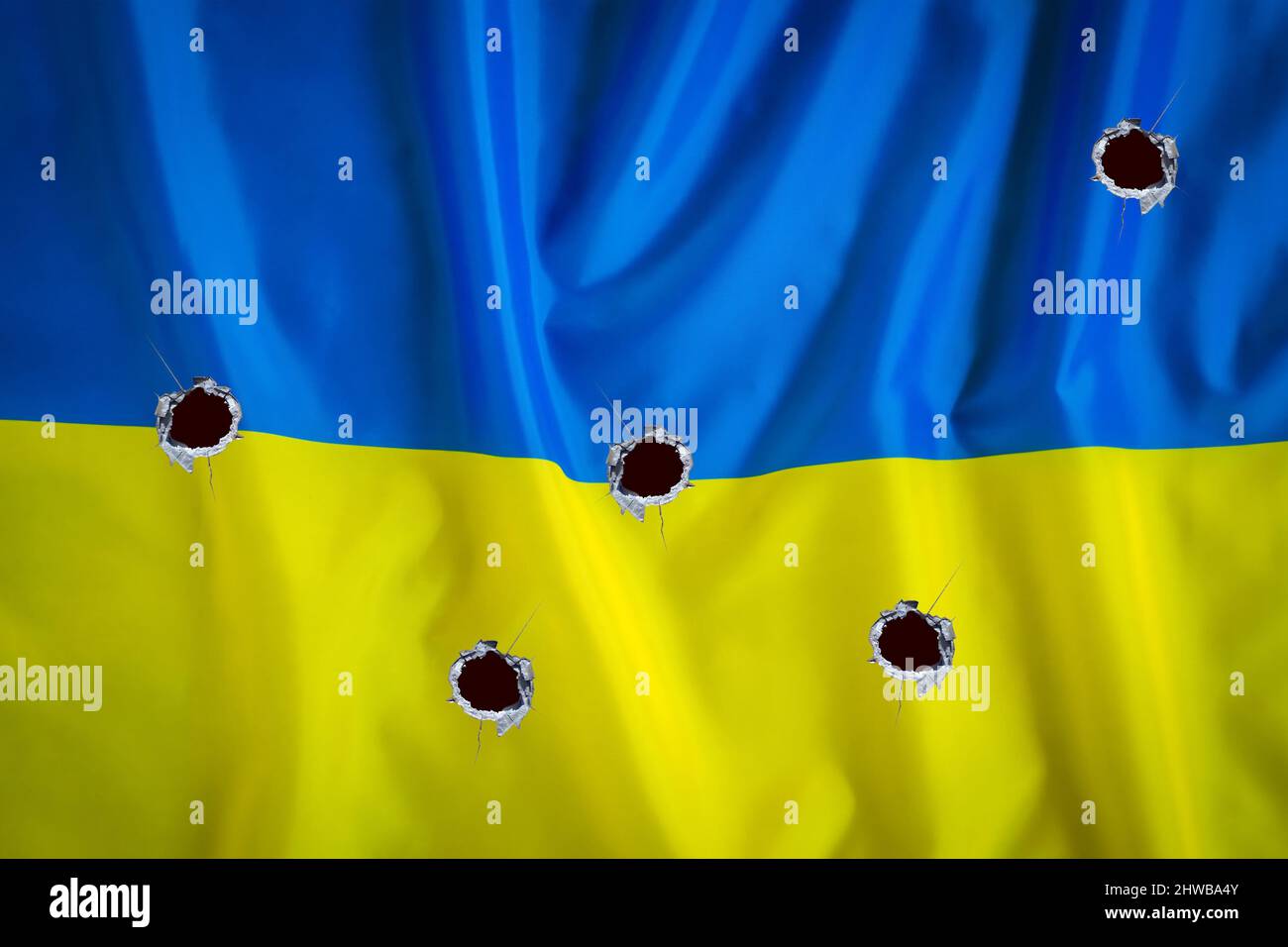 Bullet holes on a colorful cloth Stock Photo - Alamy