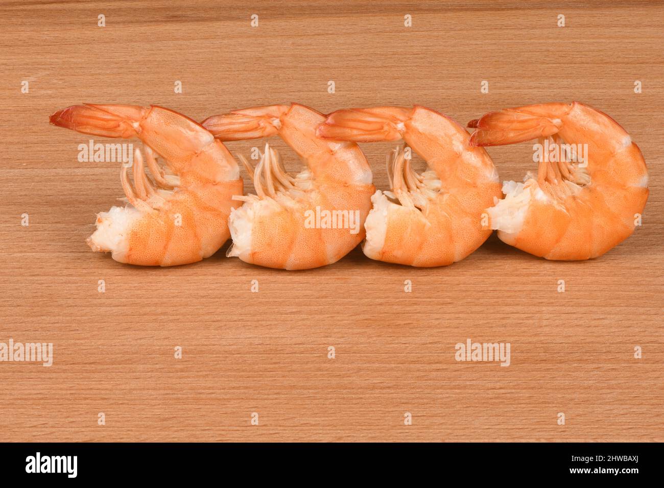 Perfectly retouched shrimp on wood background. High resolution photo ...