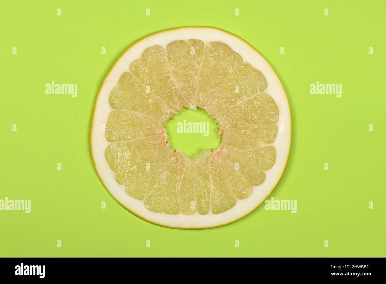 Perfectly retouched pomelo on green background. High resolution photo ...