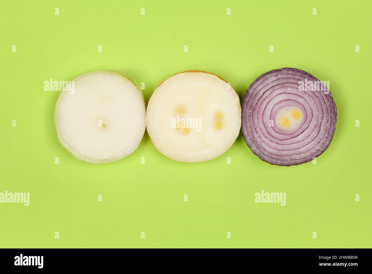 Three sliced onion of different colors (red, yellow and white) isolated ...