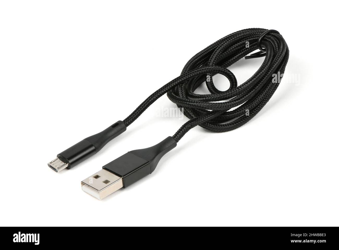 Black USB cable for charging a smartphone isolated on white. High ...