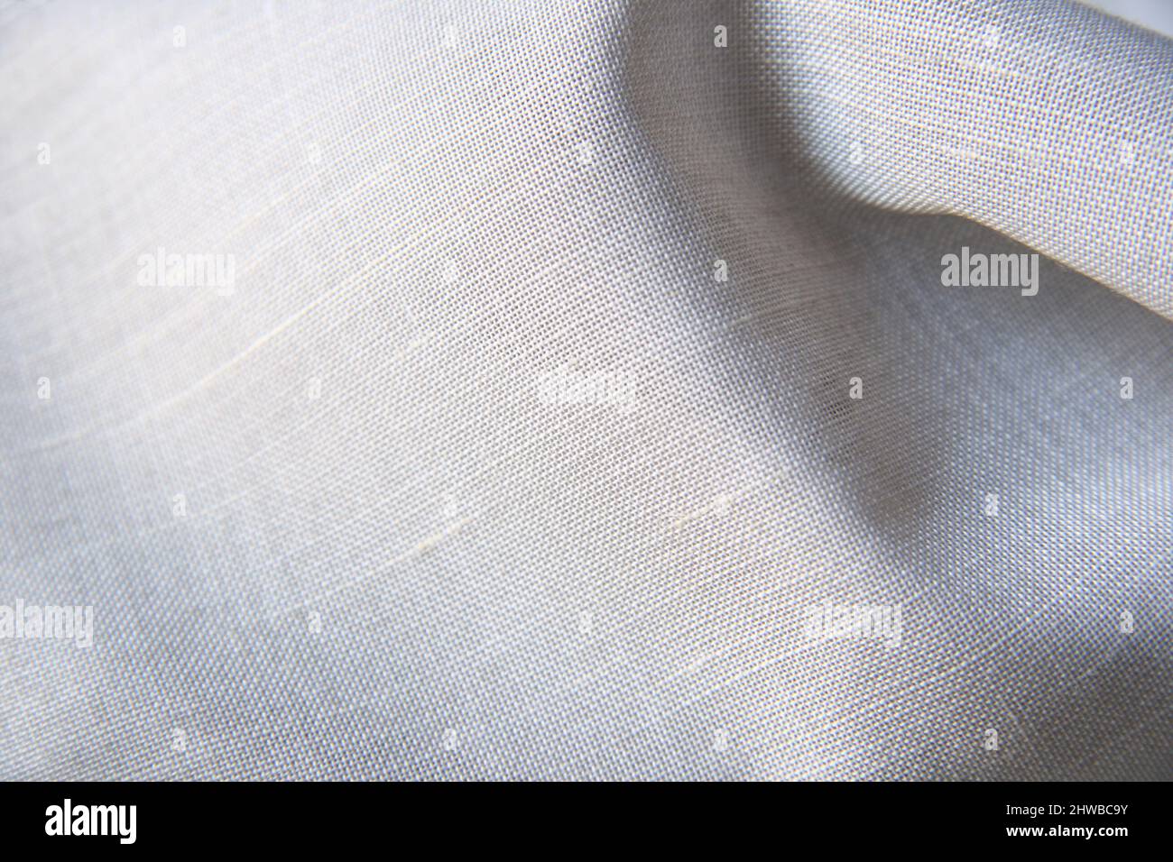 Close up shot of a piece of white wavy cotton cloth with the texture of ...