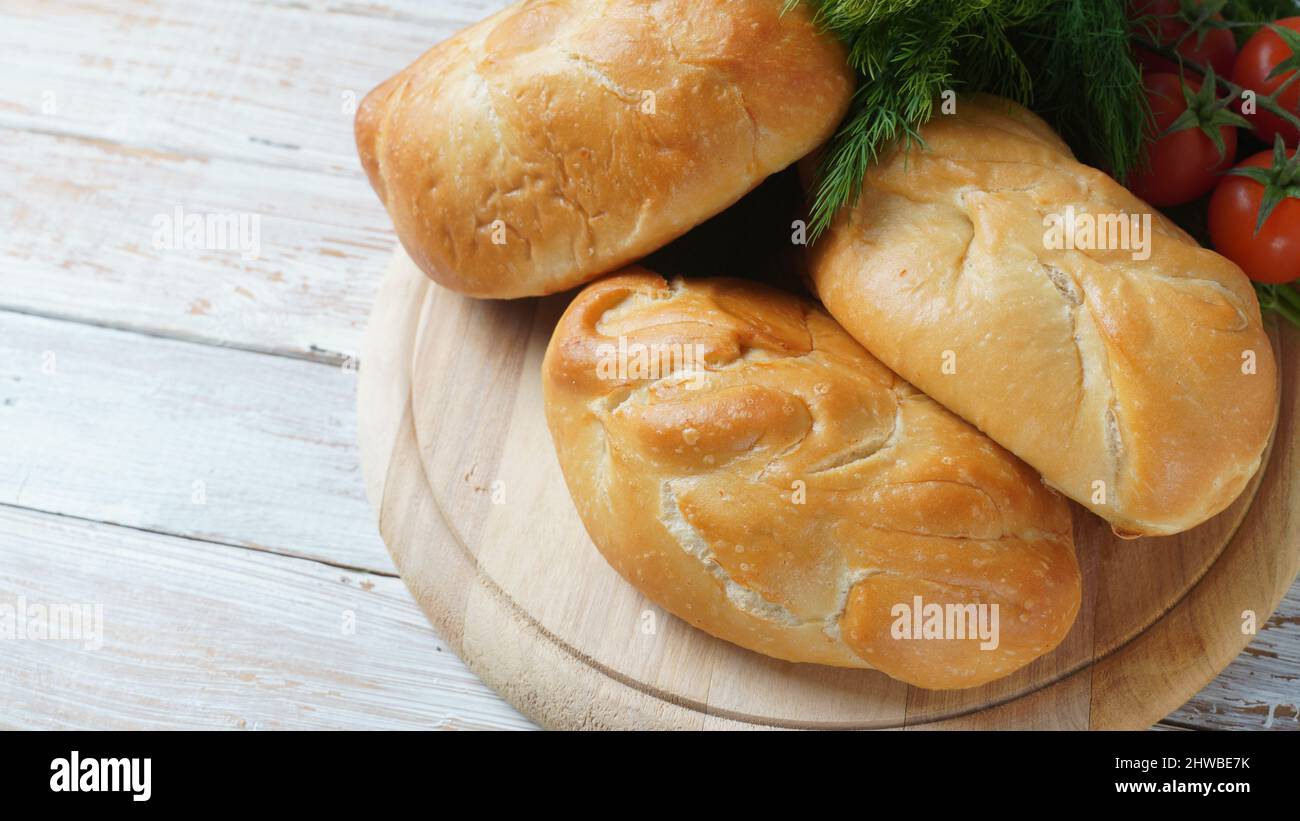 Ukrainian Patties (Pasties, Hot Cakes, Pirozhki, Pies) on wooden ...
