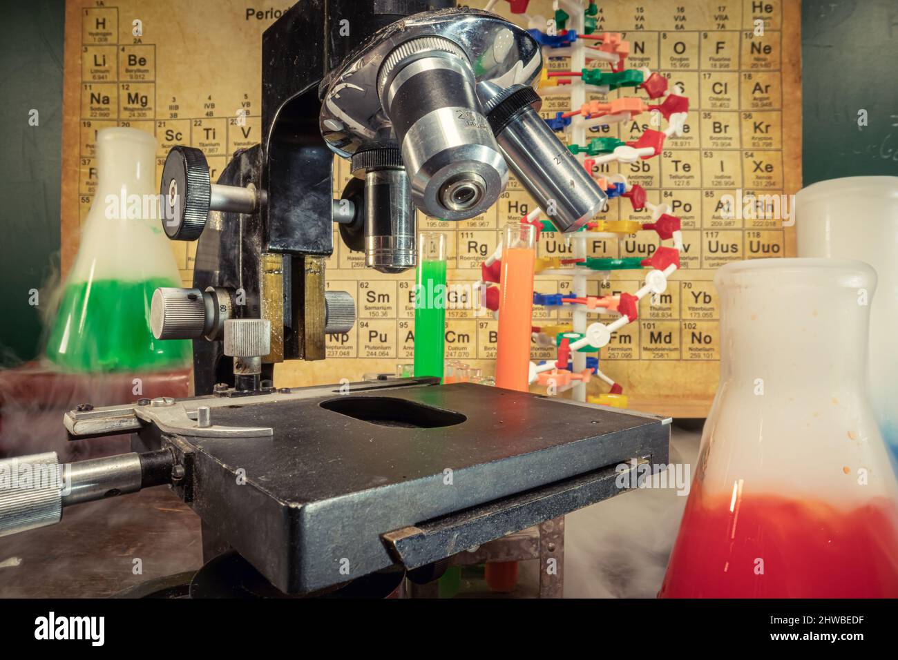 Checking chemical formula in university laboratory with beakers ...