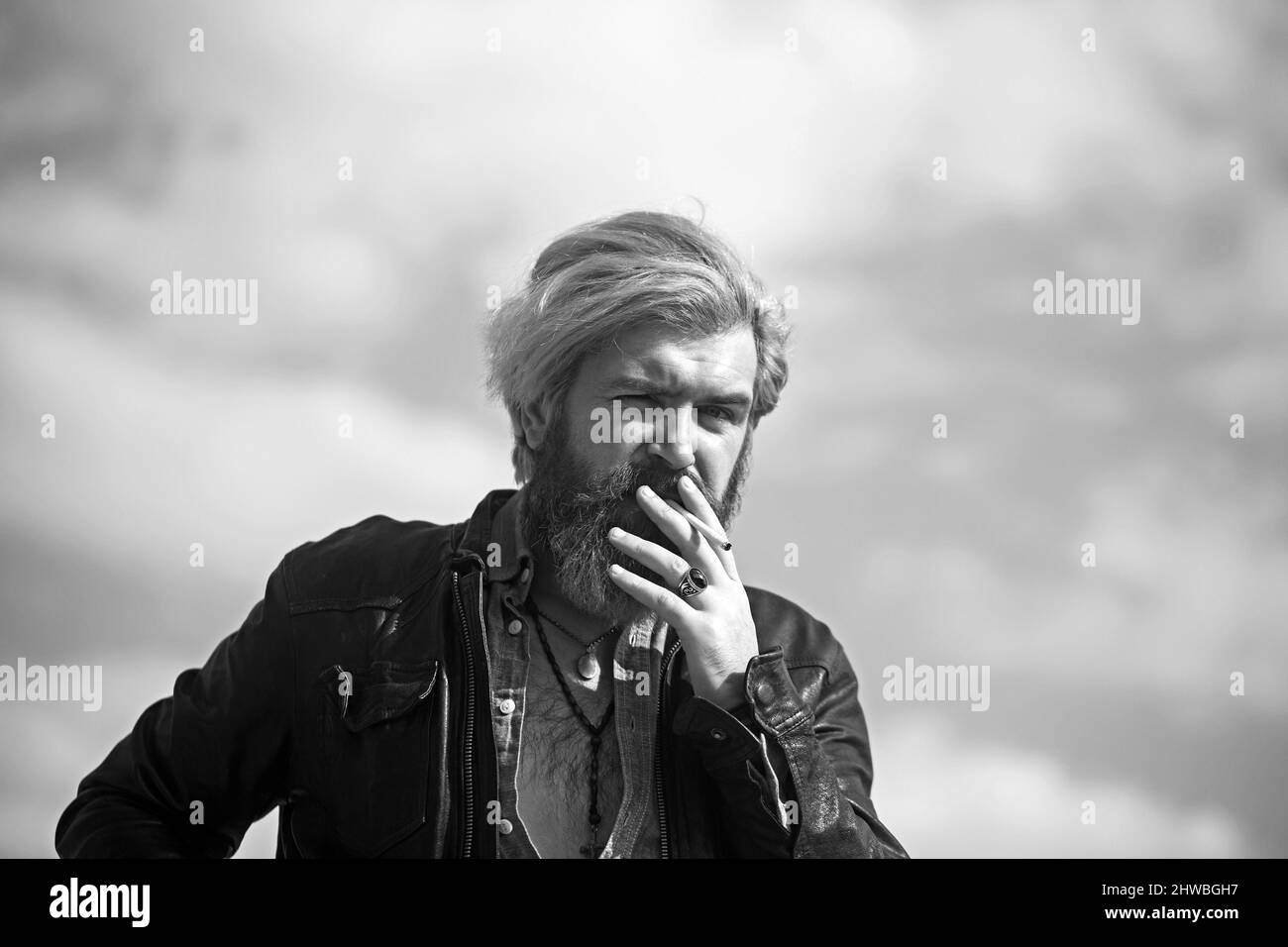 Young man standing outside smoking hi-res stock photography and images ...