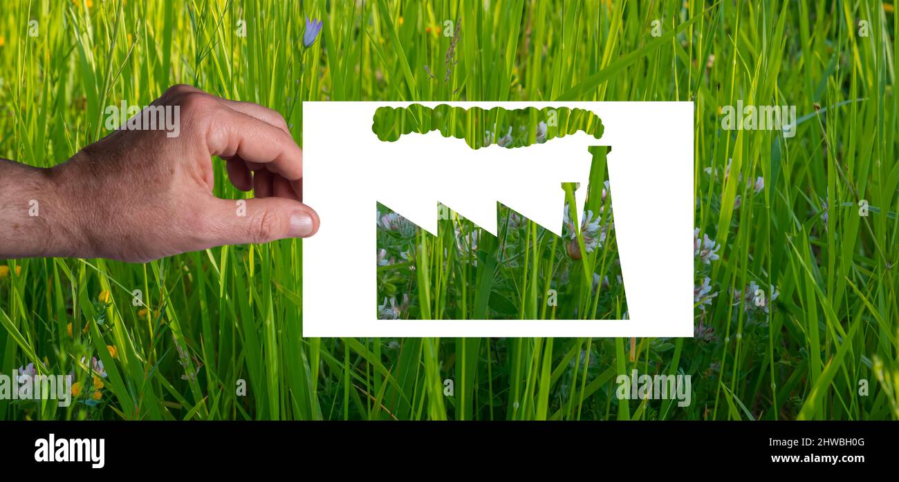 Greenwash: A man's hand holds a blank sheet of paper with the ...