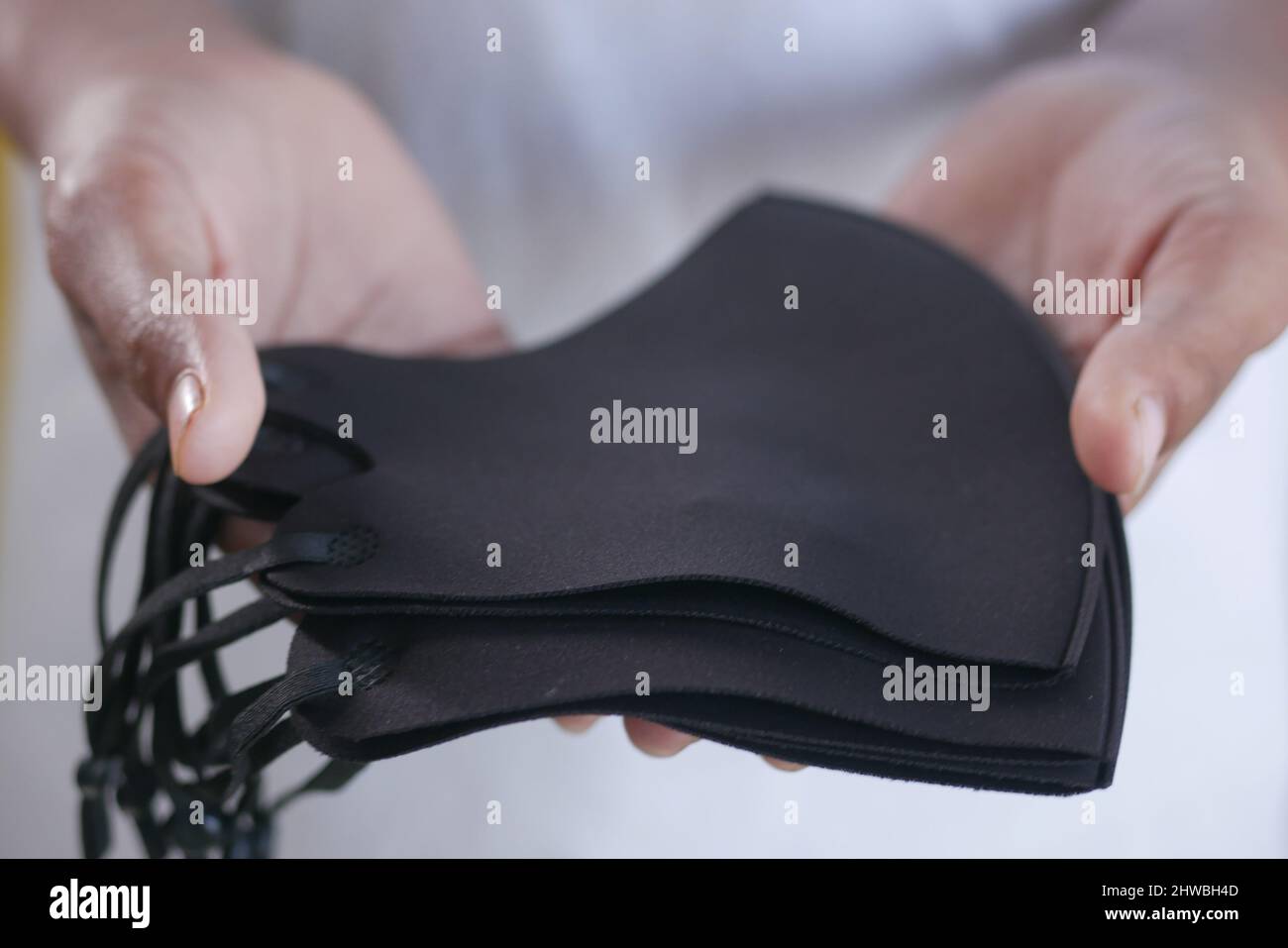 hand holding black color fabric face masks Stock Photo - Alamy