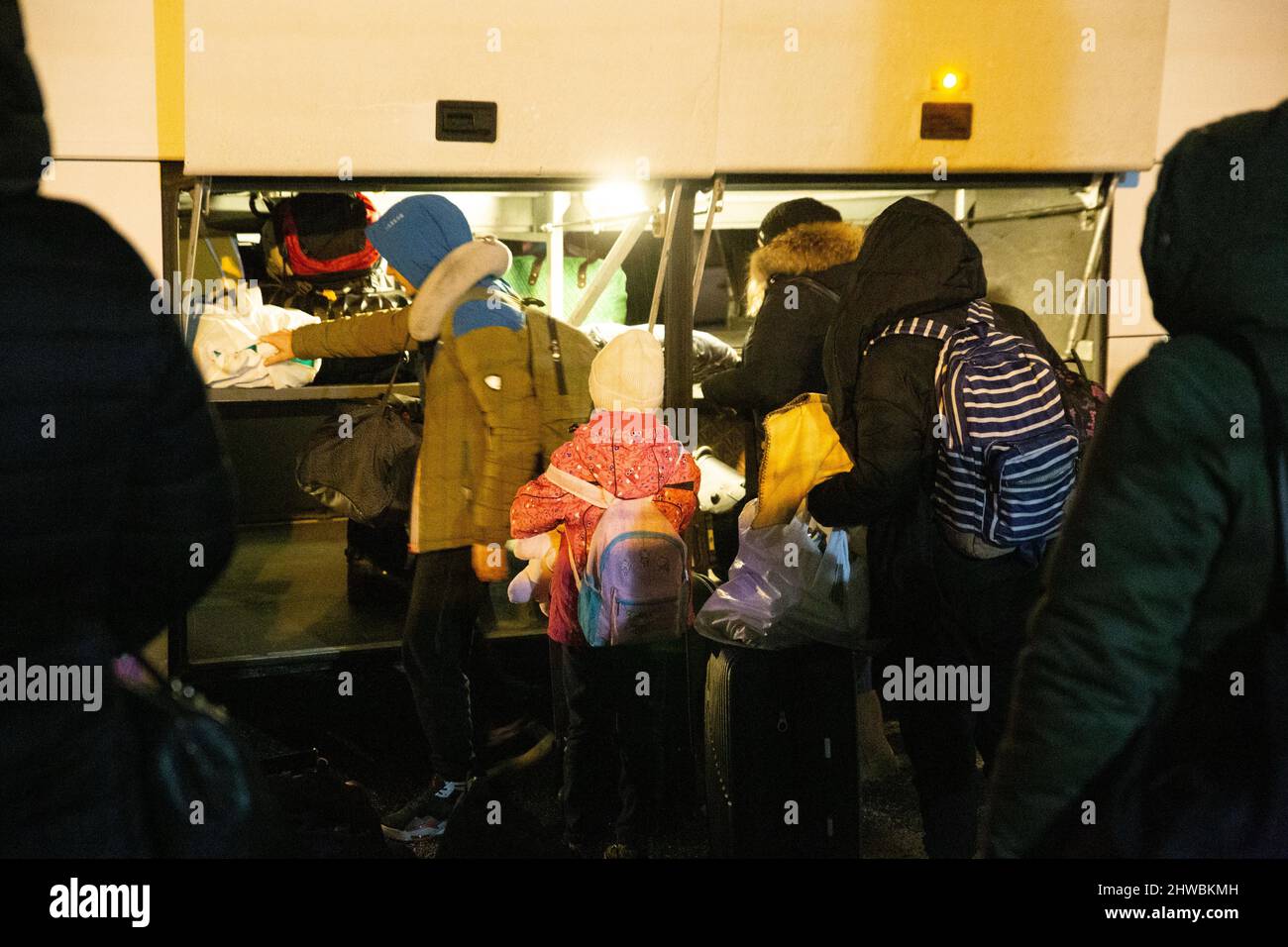 Ukrainian people get off the bus, arrived at the Roma Ostiense bus ...