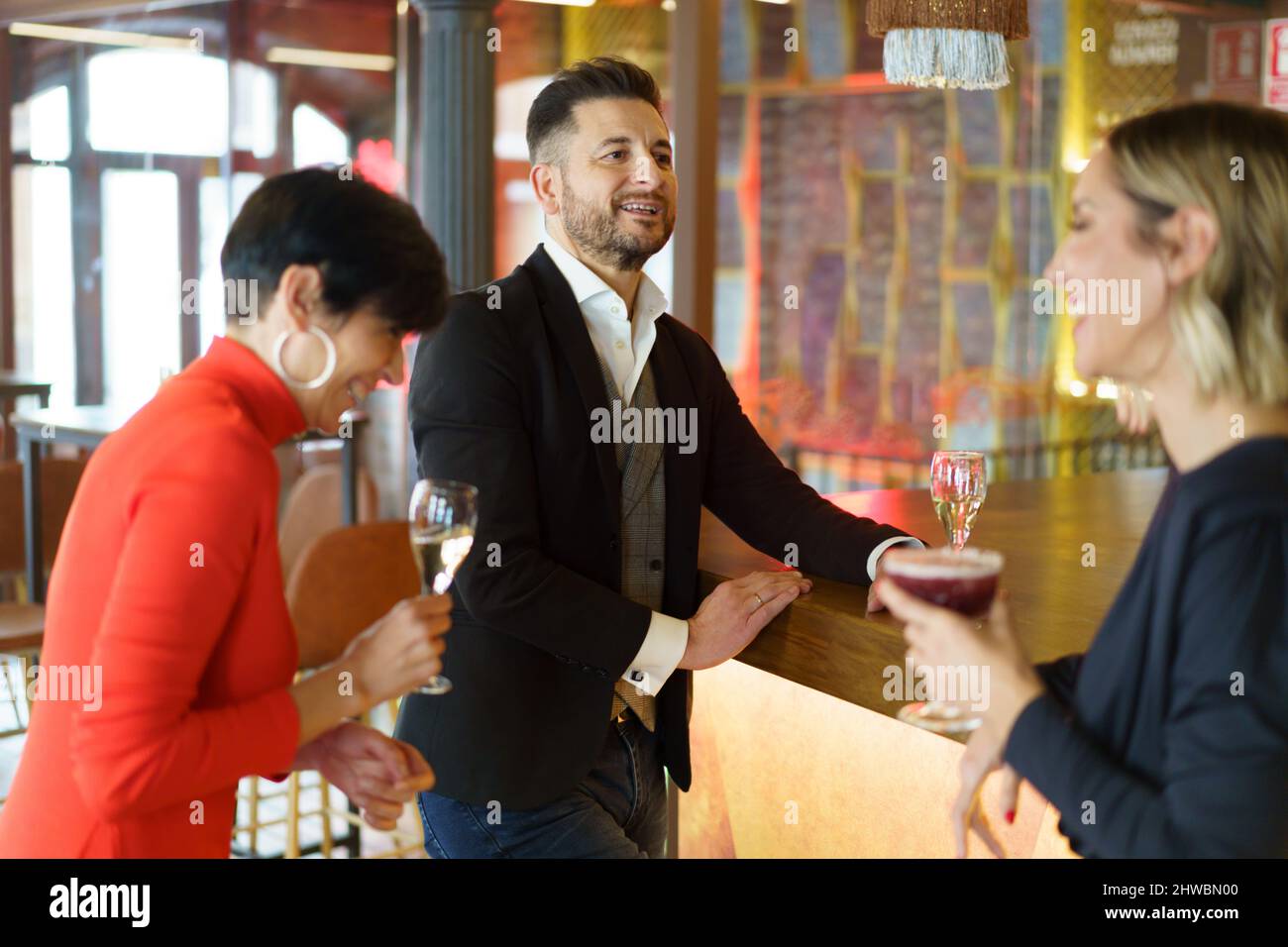 Cheerful friendly people gathering in luxury bar Stock Photo - Alamy
