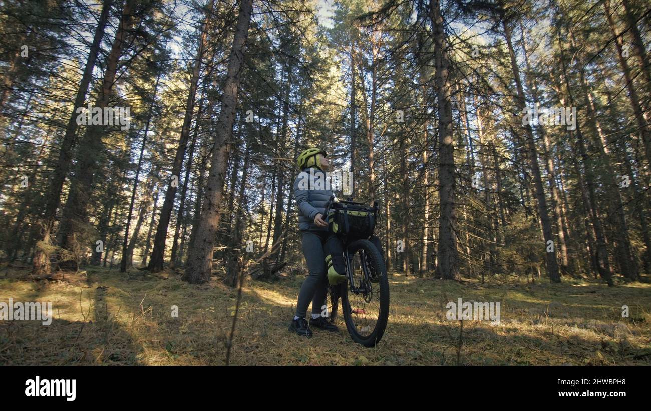 The woman travel on mixed terrain cycle touring with bike bikepacking ...