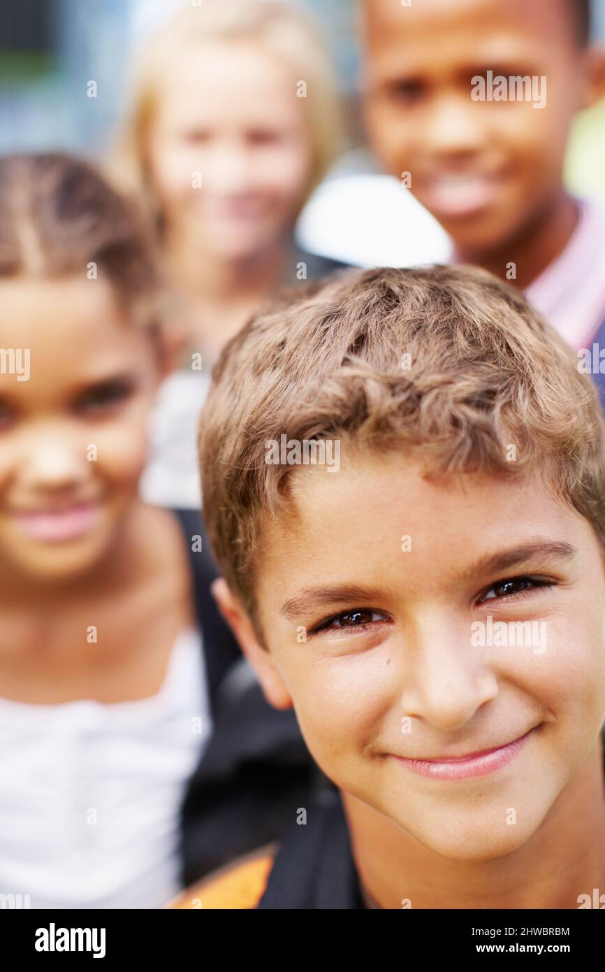 The futures in their eyes. Handsome boy smiling up at the camera with ...