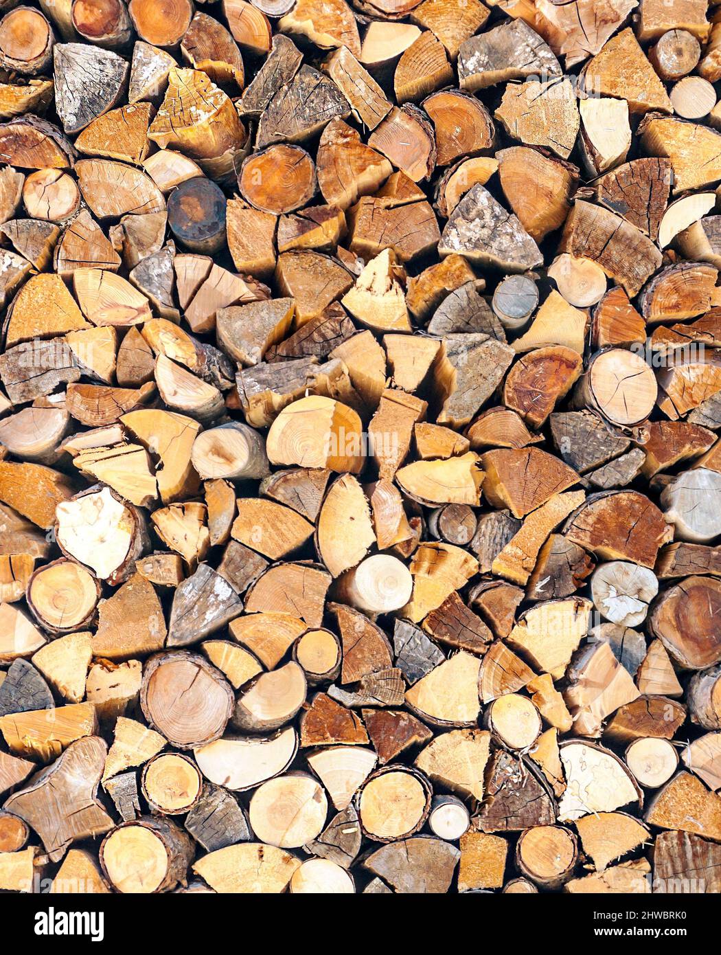 Pieces of firewood forming a background Stock Photo - Alamy