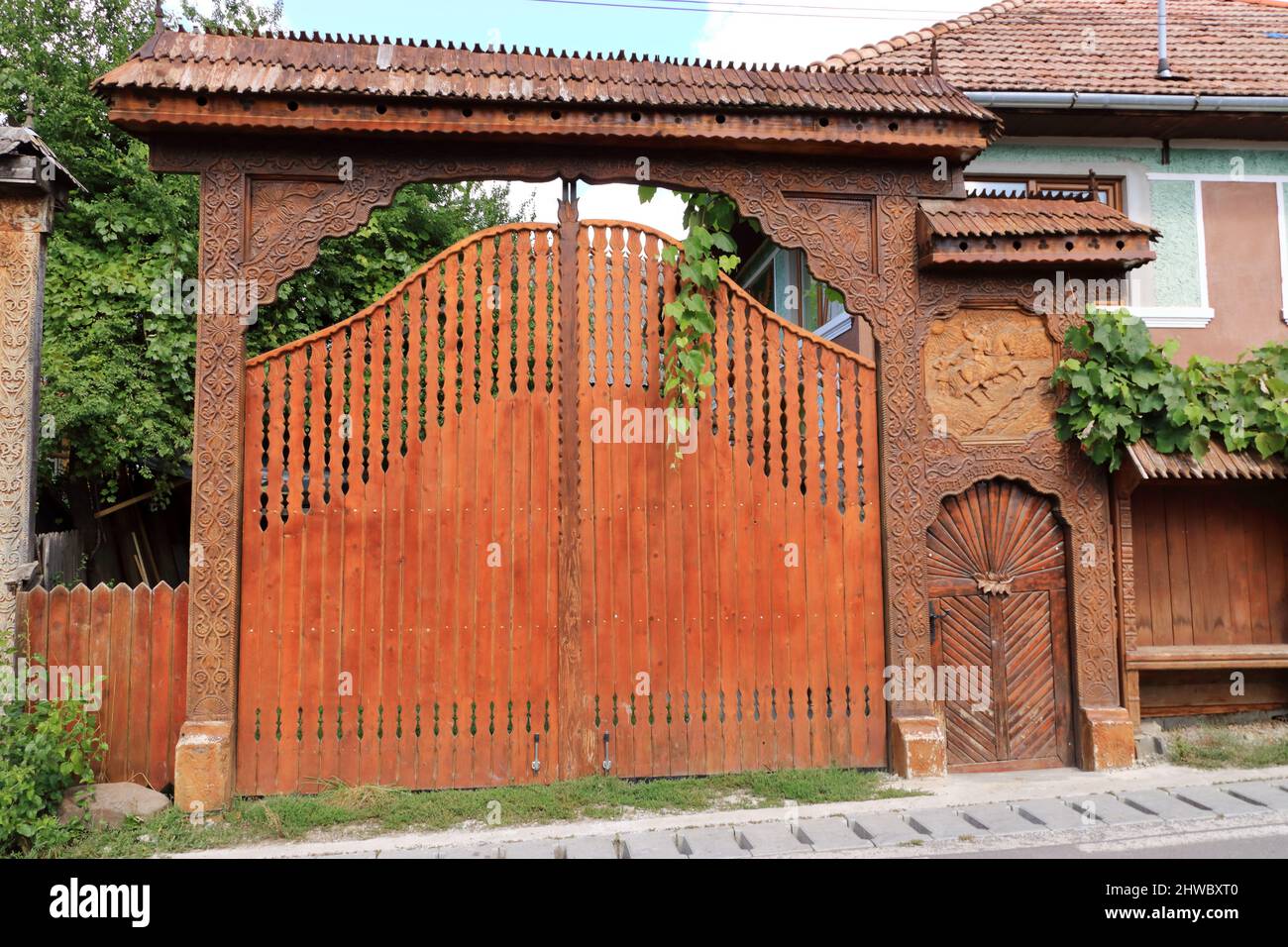 Traditional wood sculpture, decorated gate in Maramures in Romania ...
