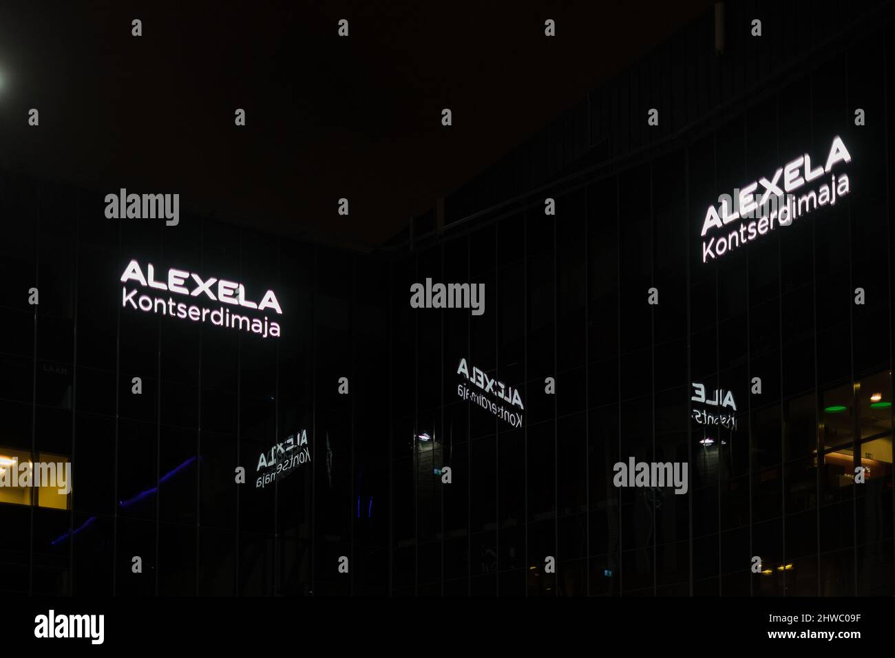 Alexela concert hall building light sign at night. Alexela ...