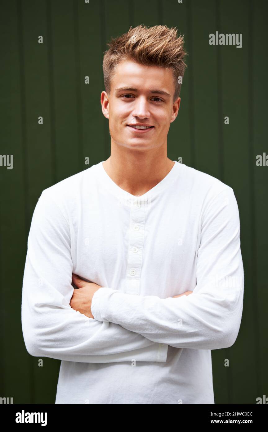 Keep calm and be a gentlemen. Portrait of a handsome young man standing ...