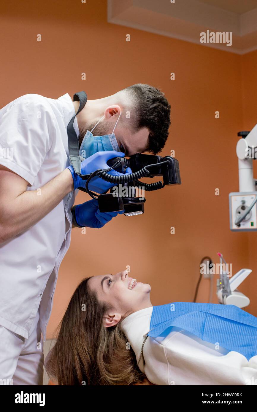 Dentist takes pictures patients teeth hi-res stock photography and ...