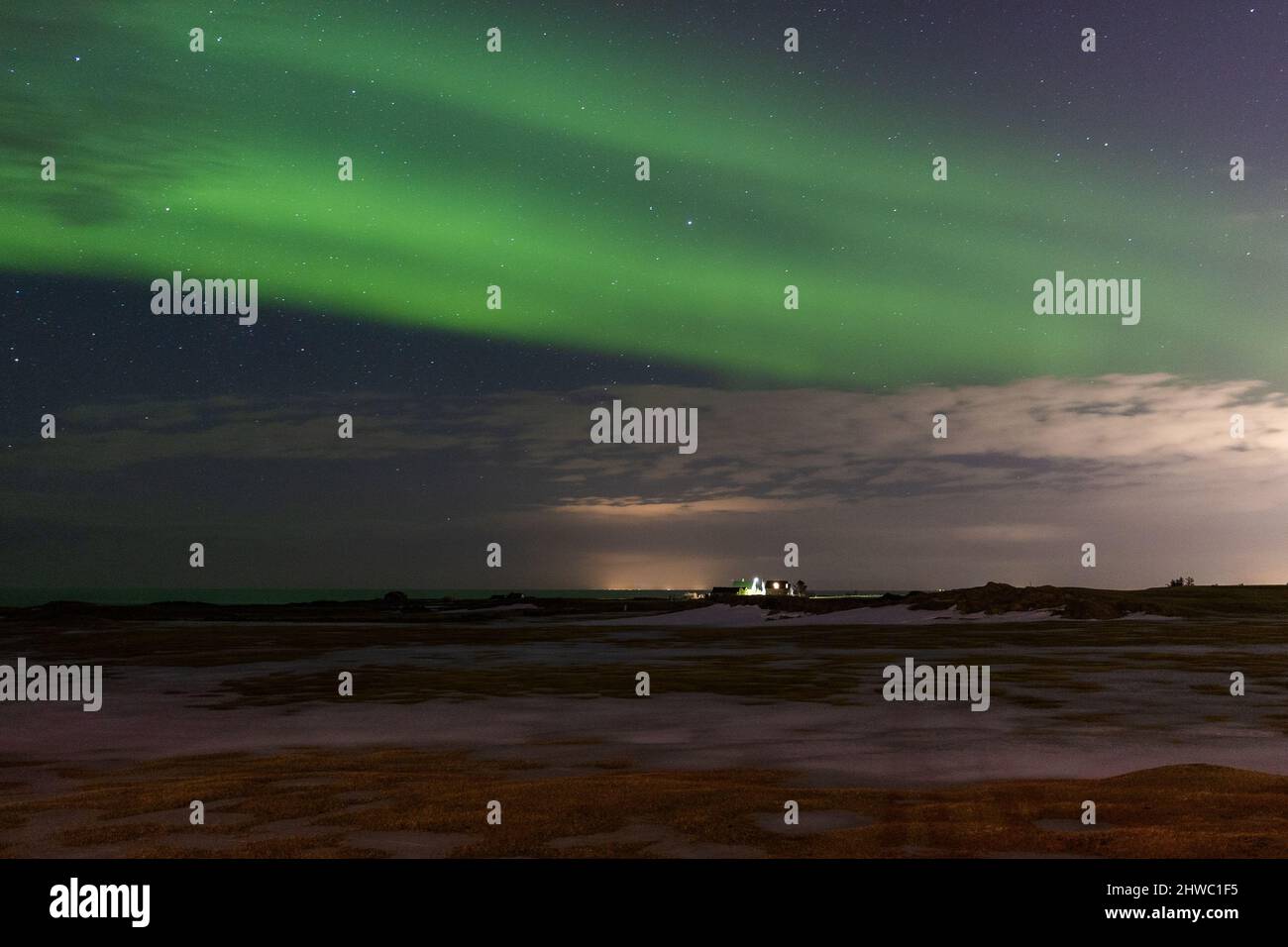Northern lights over Garður lighthouse & churches Stock Photo - Alamy