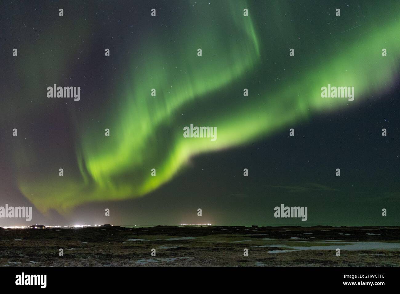 Northern lights over Garður lighthouse & churches Stock Photo - Alamy