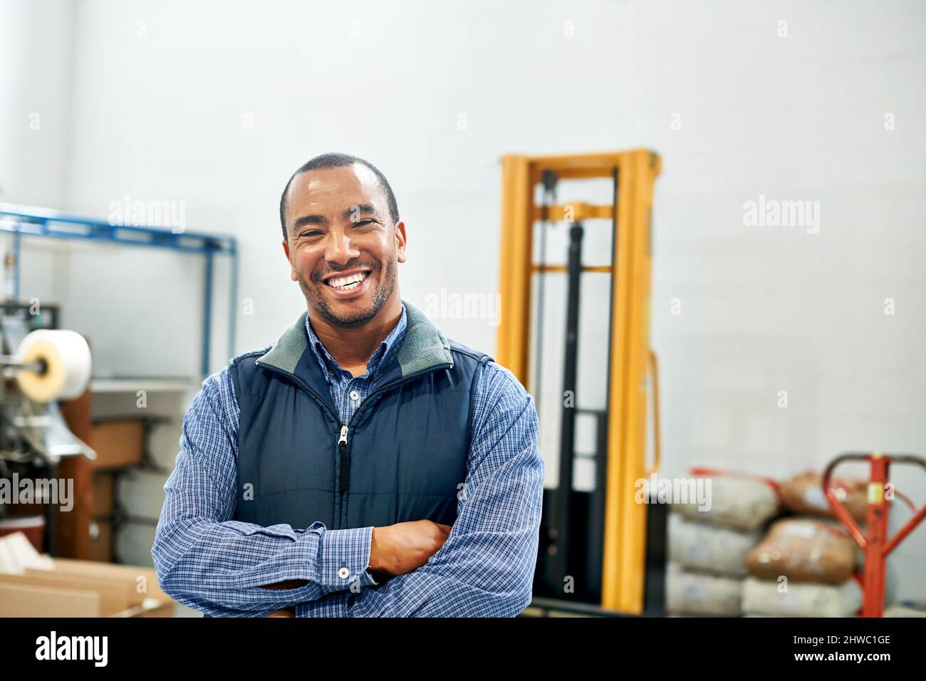 My factory floor is a well-oiled machine. Portrait of a smiling factory ...