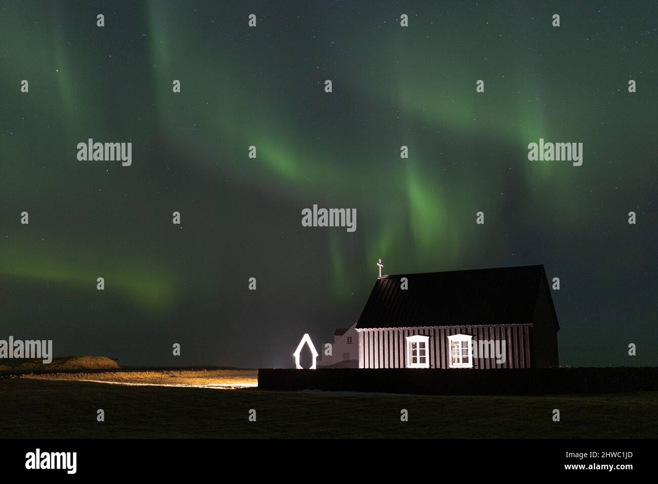 Northern lights over Garður lighthouse & churches Stock Photo - Alamy