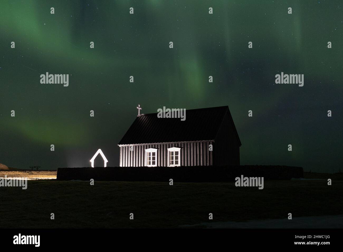 Northern lights over Garður lighthouse & churches Stock Photo - Alamy