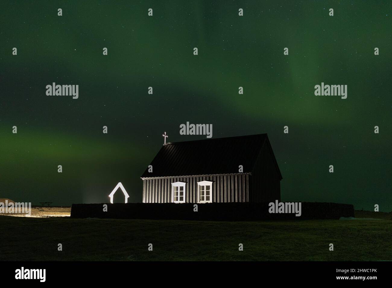 Northern lights over Garður lighthouse & churches Stock Photo - Alamy