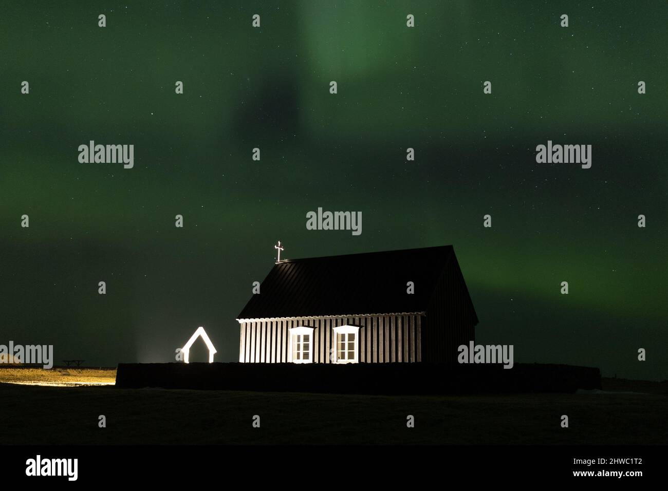 Northern lights over Garður lighthouse & churches Stock Photo - Alamy