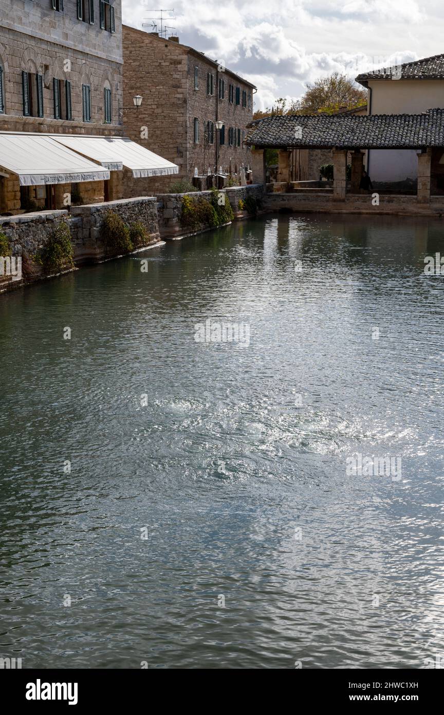 Ancient natural hot springs stone pool in small Italian village Bagno ...