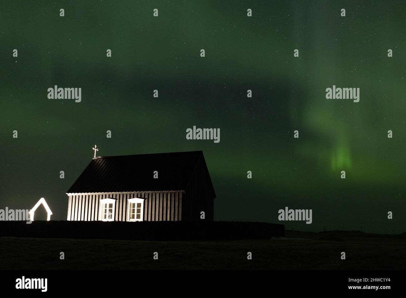 Northern lights over Garður lighthouse & churches Stock Photo - Alamy