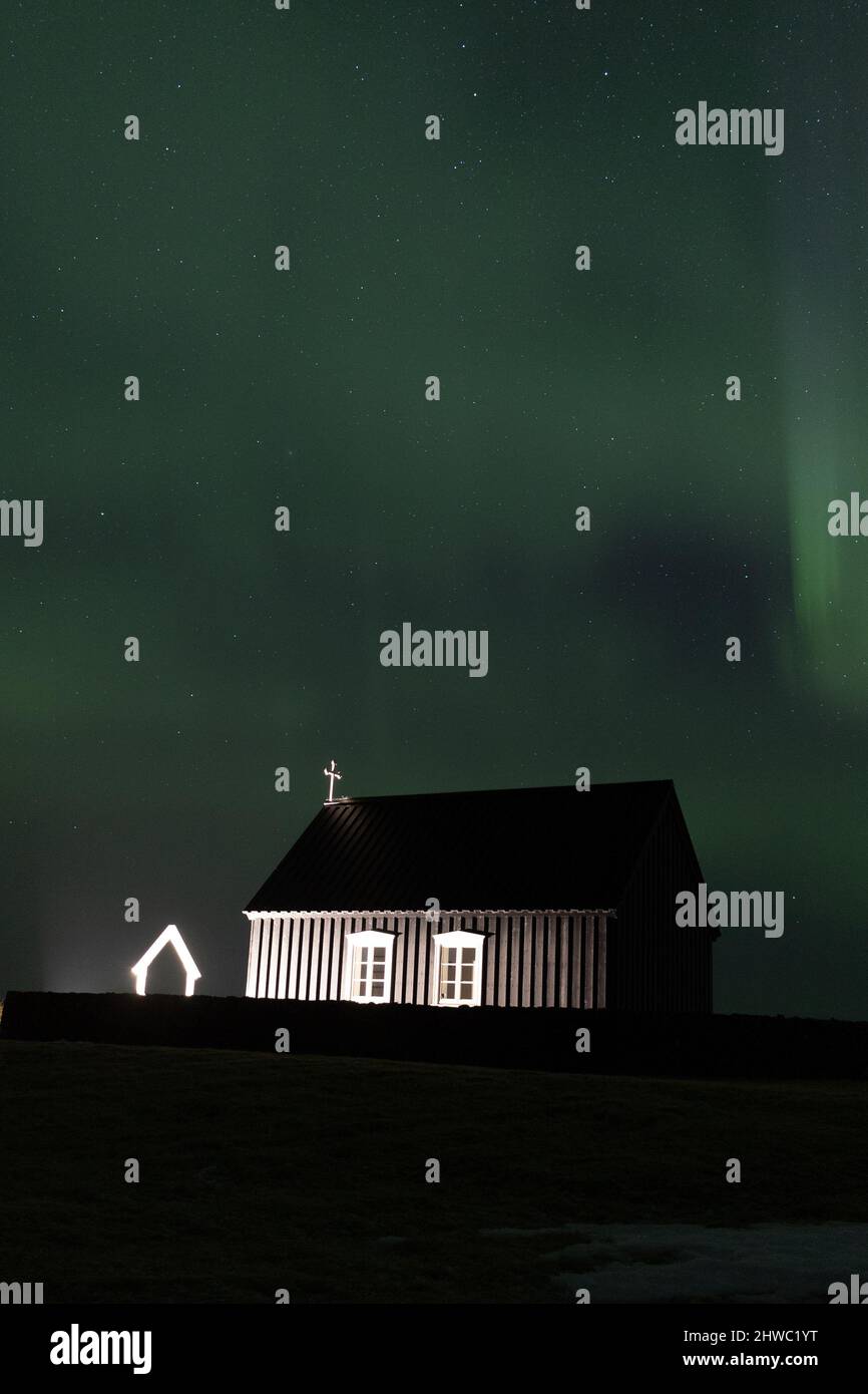 Northern lights over Garður lighthouse & churches Stock Photo - Alamy