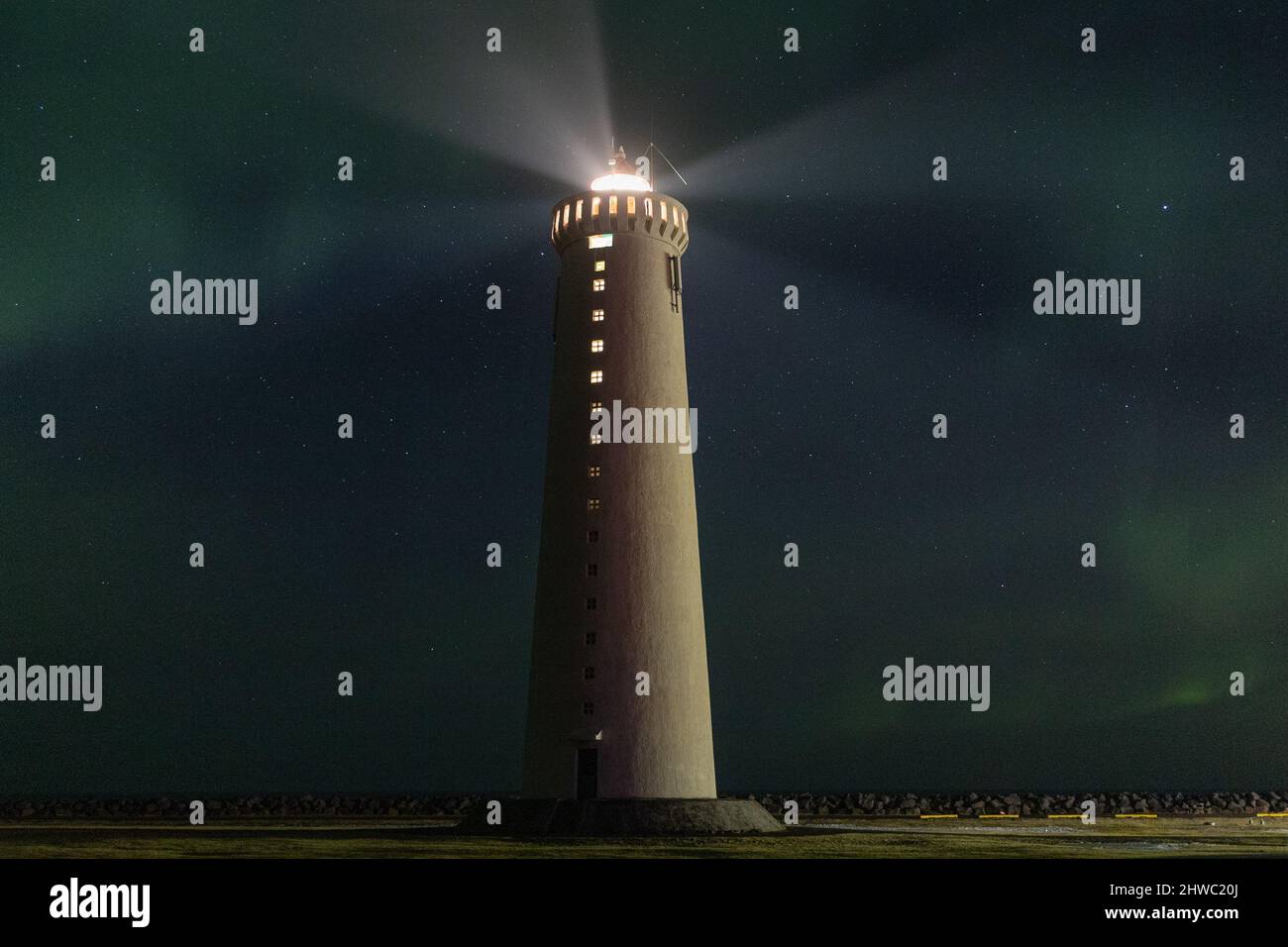 Northern lights over Garður lighthouse & churches Stock Photo - Alamy