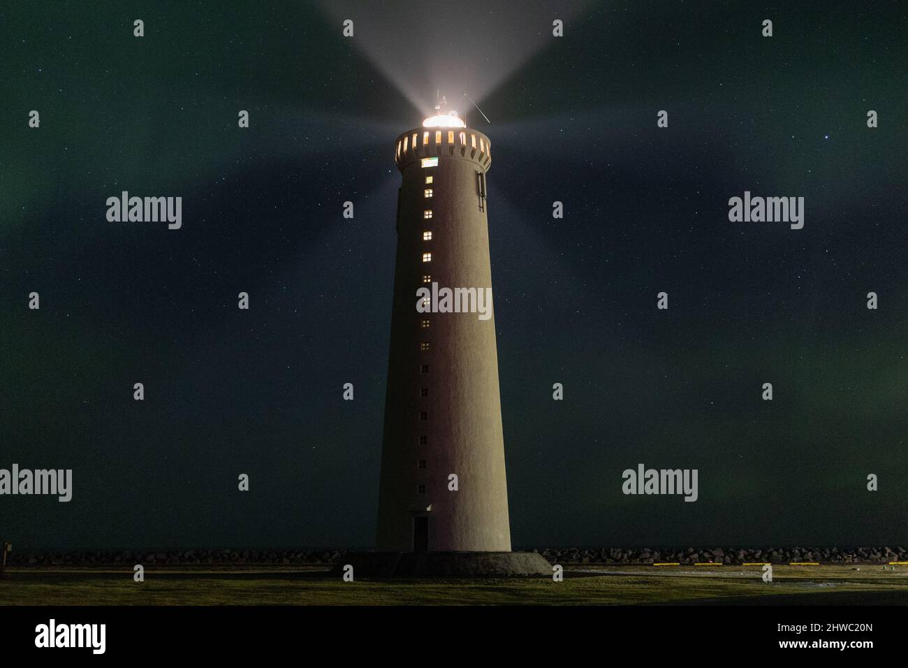 Northern lights over Garður lighthouse & churches Stock Photo - Alamy