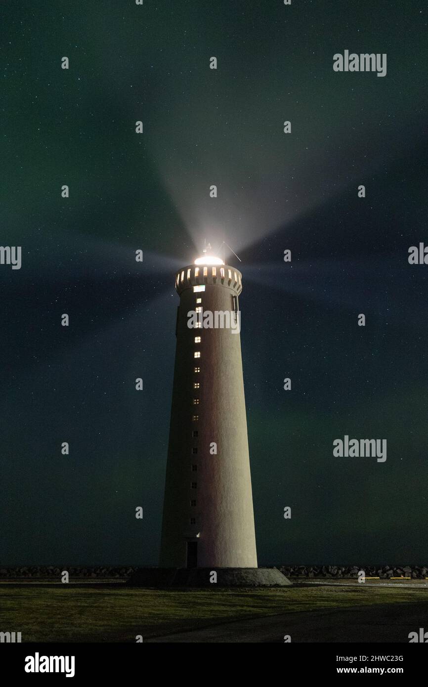 Northern lights over Garður lighthouse & churches Stock Photo - Alamy