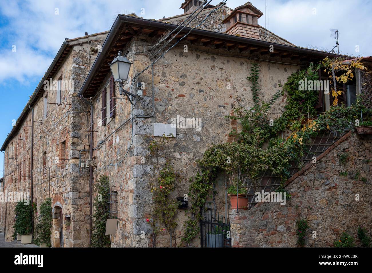 Houses inside old town walls in medieval fortress town on hilltop ...