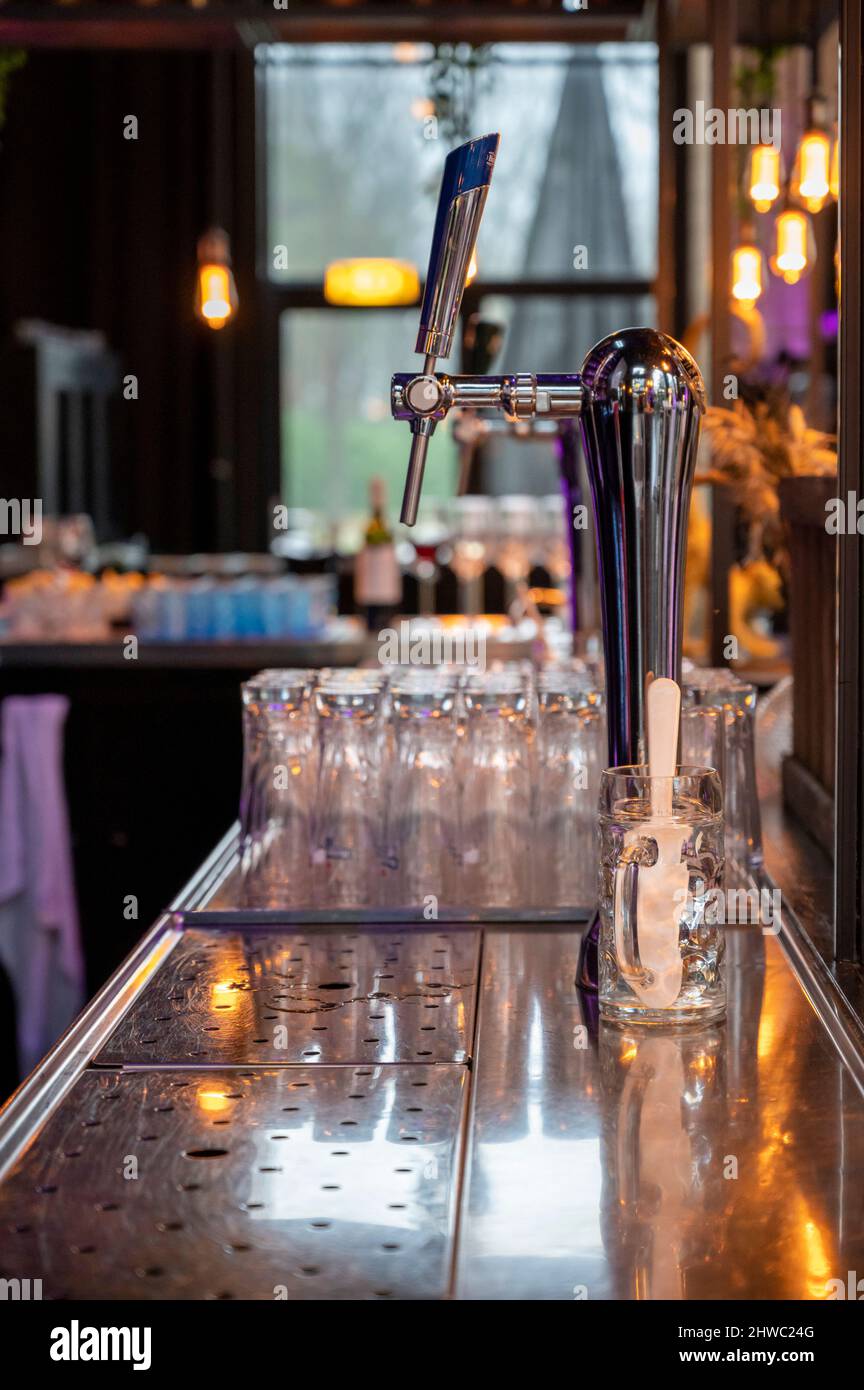 Interior of classic beer and whisky bar with beer taps and empty ...