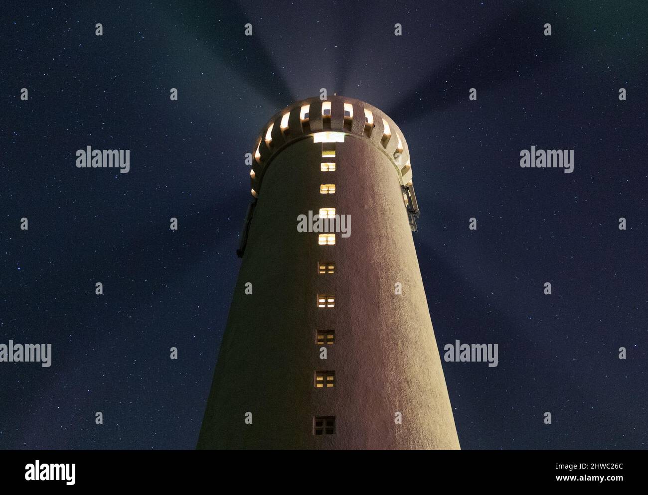 Northern lights over Garður lighthouse & churches Stock Photo - Alamy