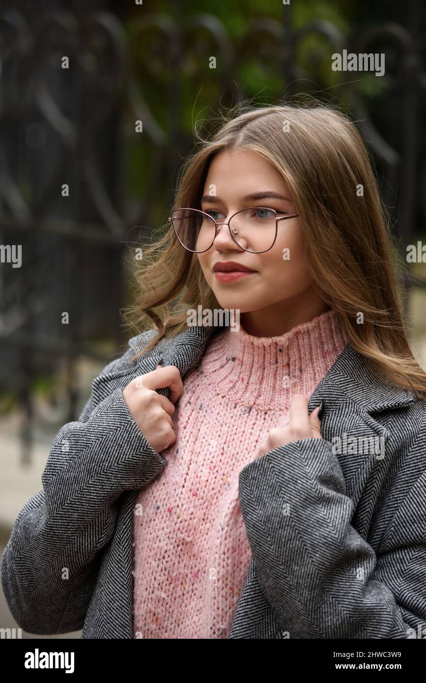 Fashionable and beautiful young woman 16-20 years old, dressed in an ...