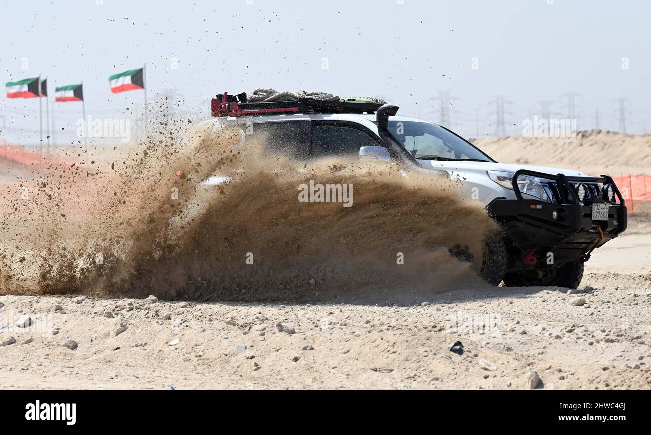 Jahra Governorate, Kuwait. 5th Mar, 2022. Rakan Hamad steers the car ...