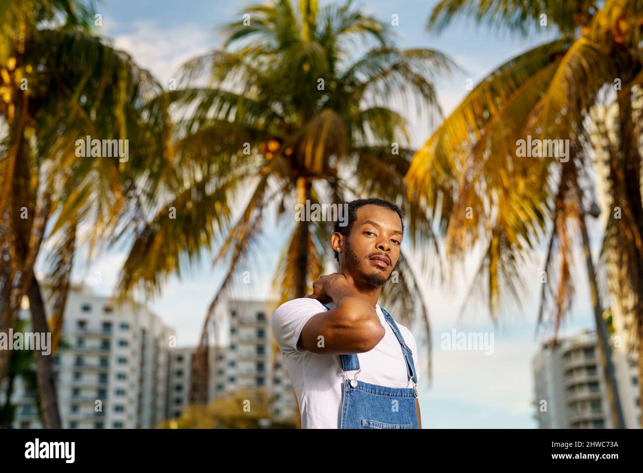 Portrait photo of a man in the park with palm trees in background Stock ...