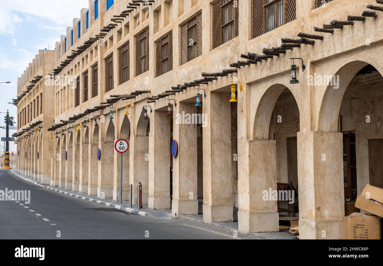 Middle eastern architecture with bamboo wooden poles sticking out of a ...