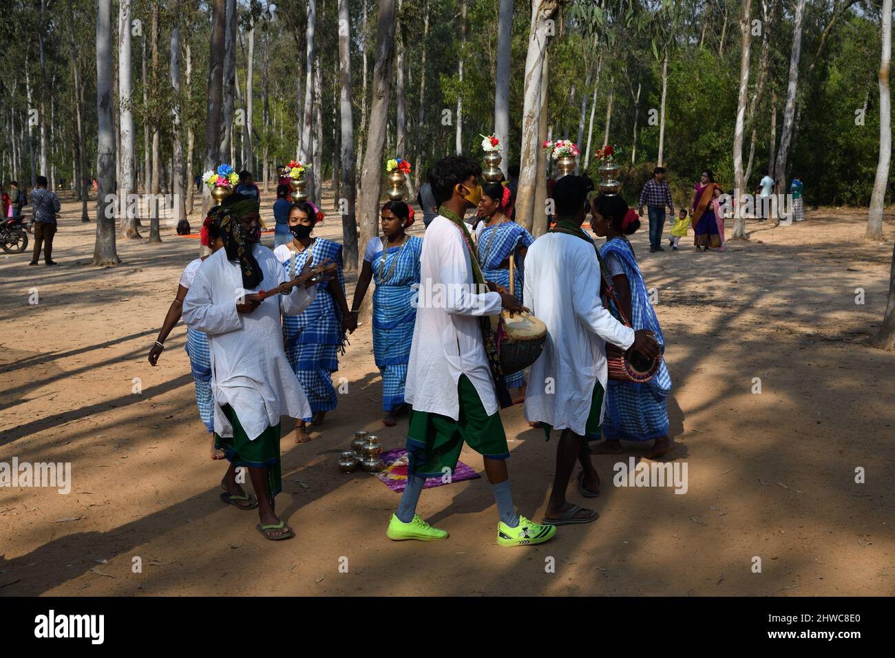 Local traditional dressed Santali men and women are preparing ...