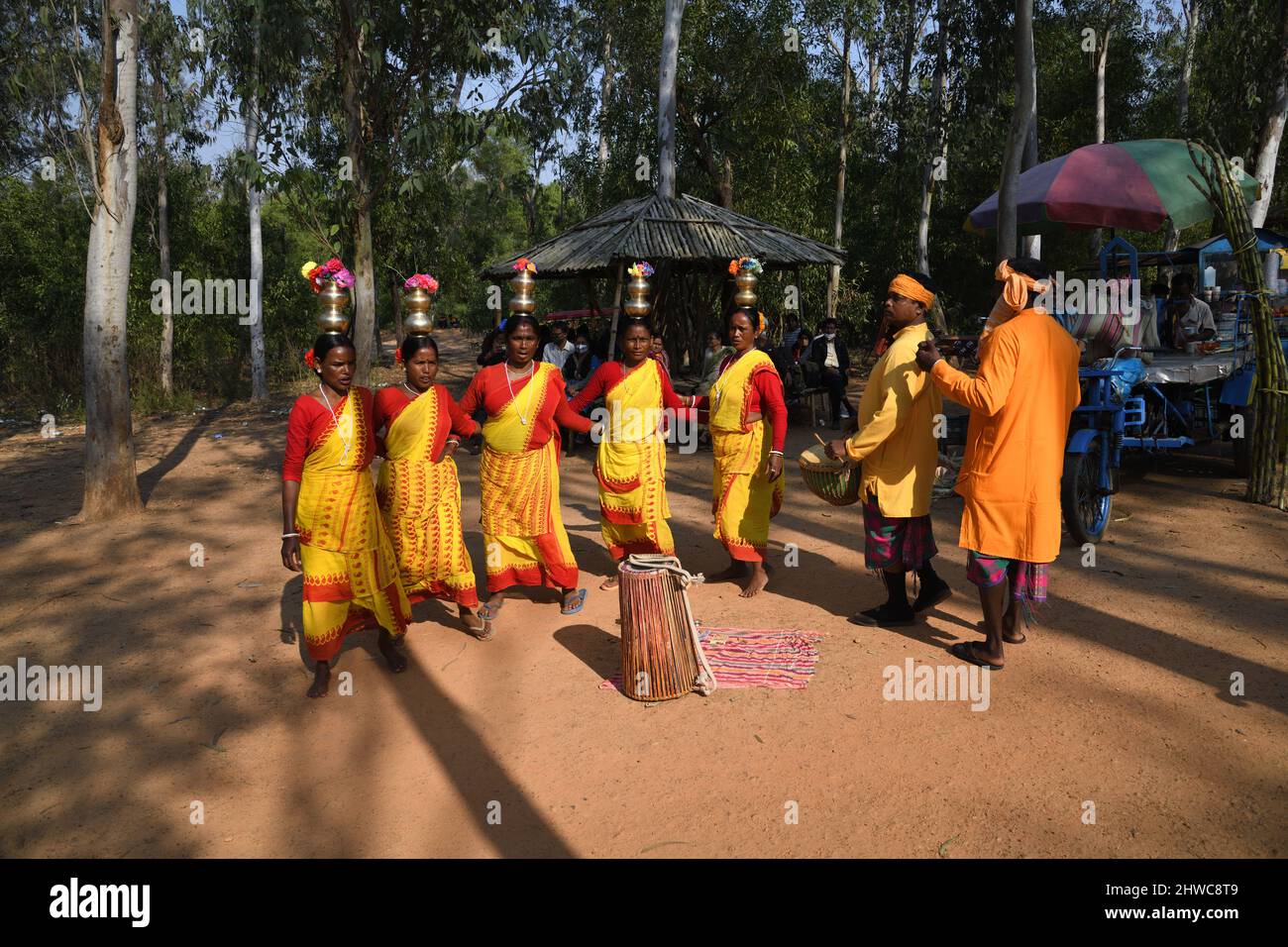 Local traditional dressed Santali men and women are preparing ...