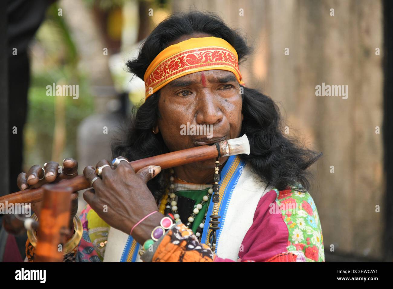A flute player of a Baul song group performing at Sonajhuri haat near ...