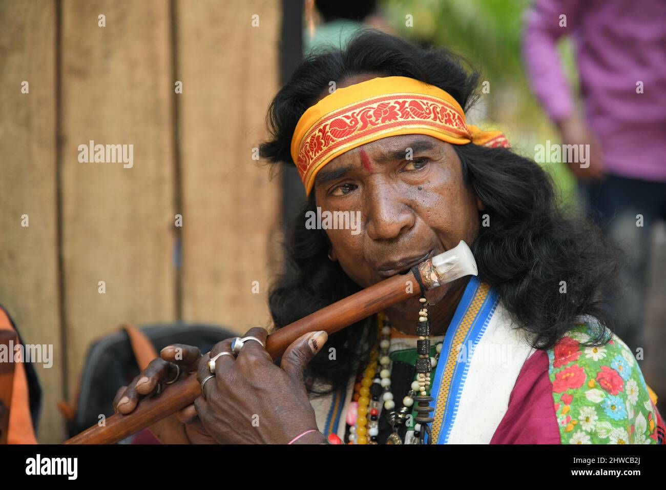 A flute player of a Baul song group performing at Sonajhuri haat near ...