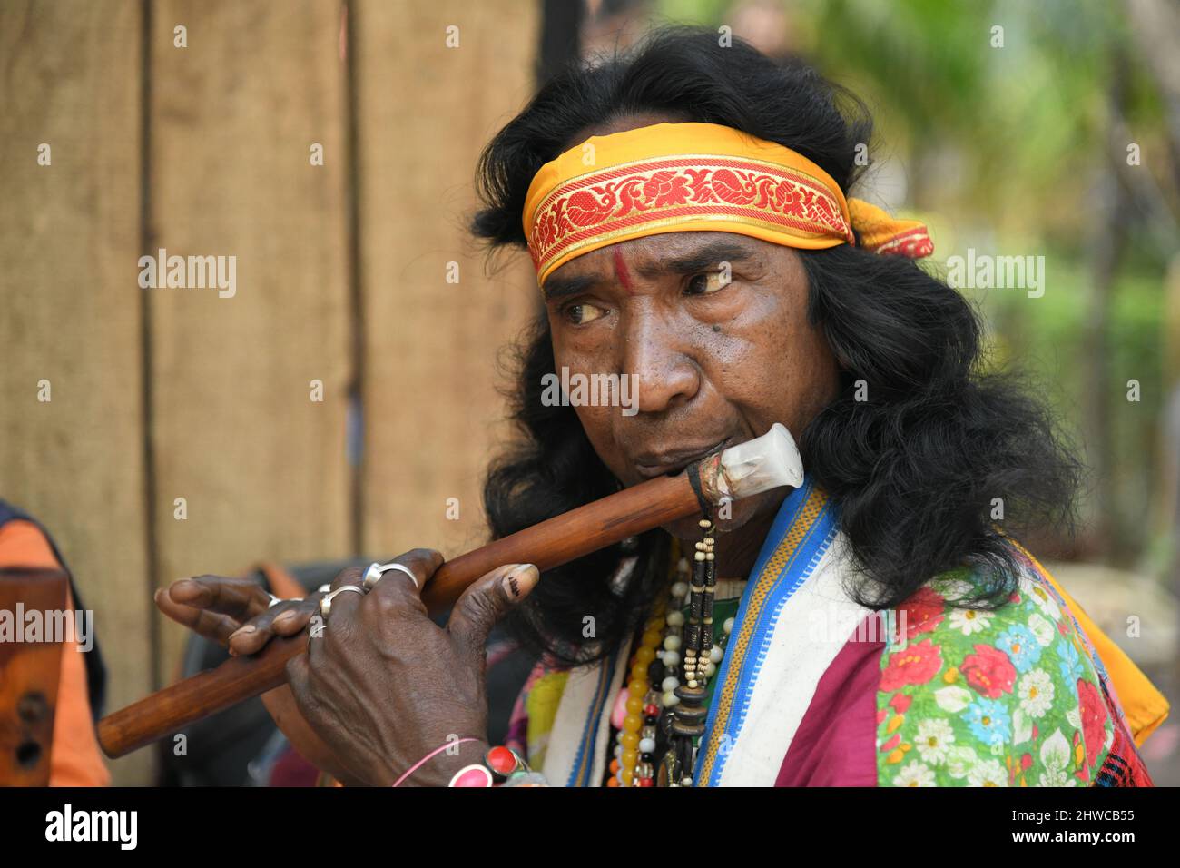 A flute player of a Baul song group performing at Sonajhuri haat near ...