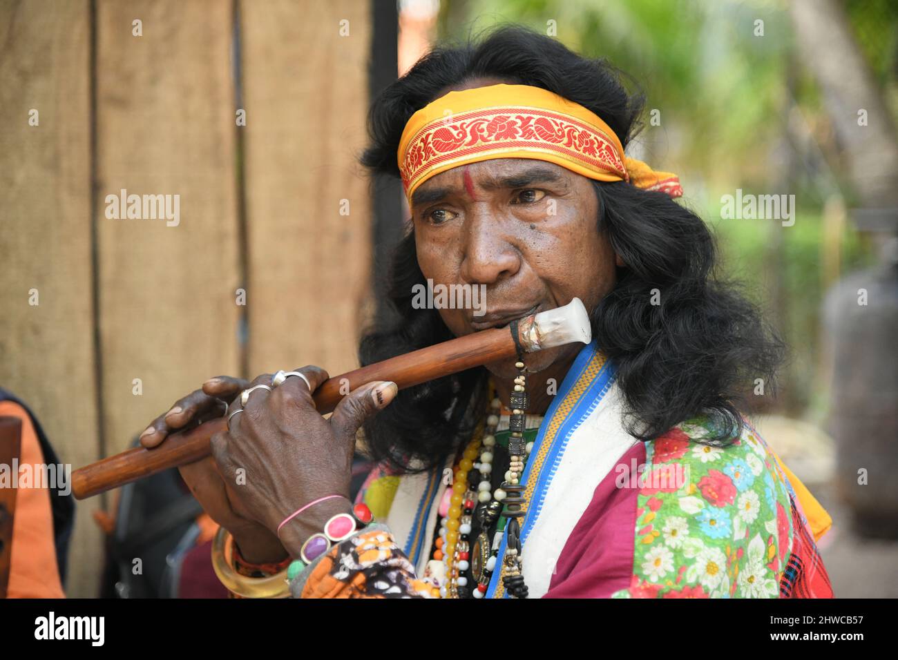 A flute player of a Baul song group performing at Sonajhuri haat near ...