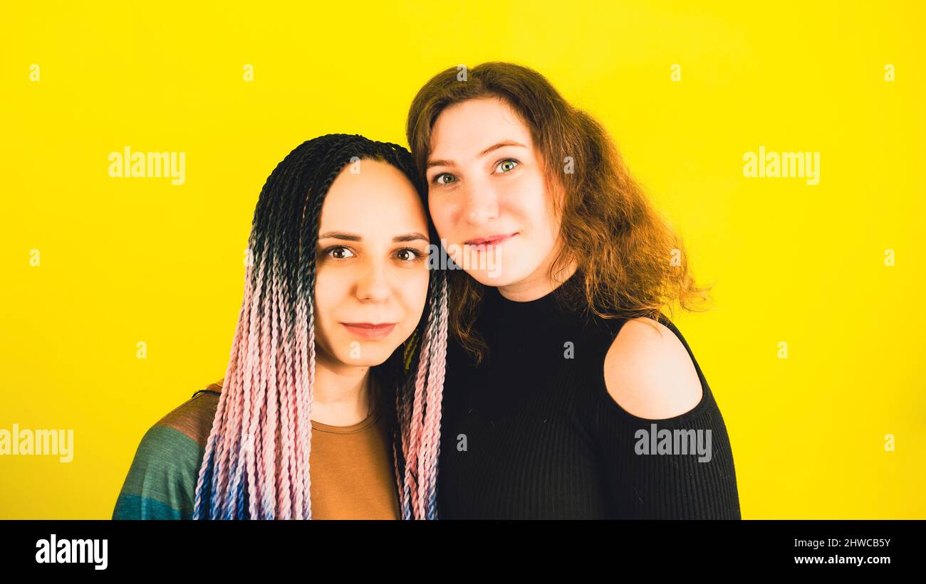 Pretty females smiling, expressing positive emotions Stock Photo - Alamy