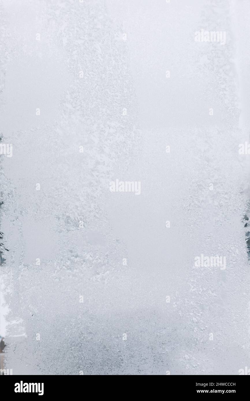 Frost patterns on frozen window. frosted glass texture Stock Photo - Alamy