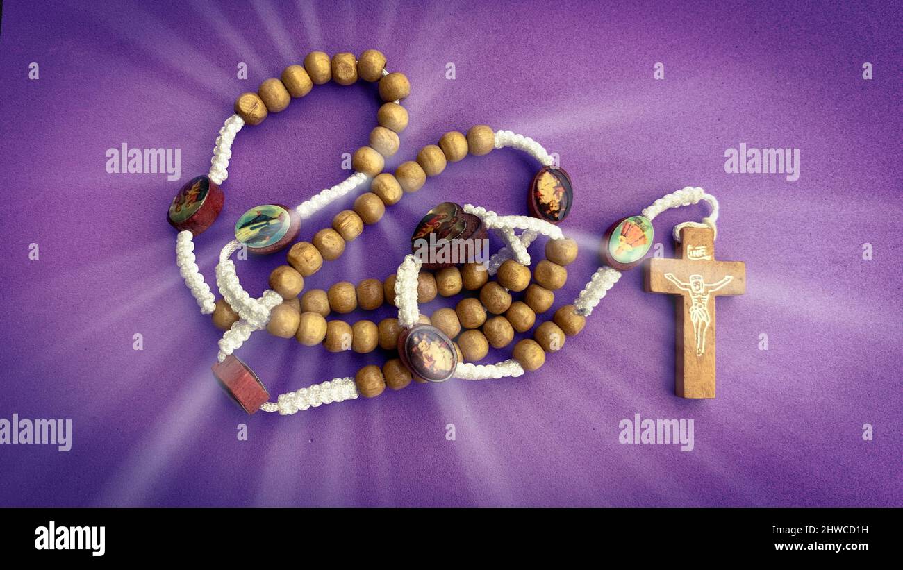 Holy Rosary on purple background. Christian prayer concept Stock Photo ...